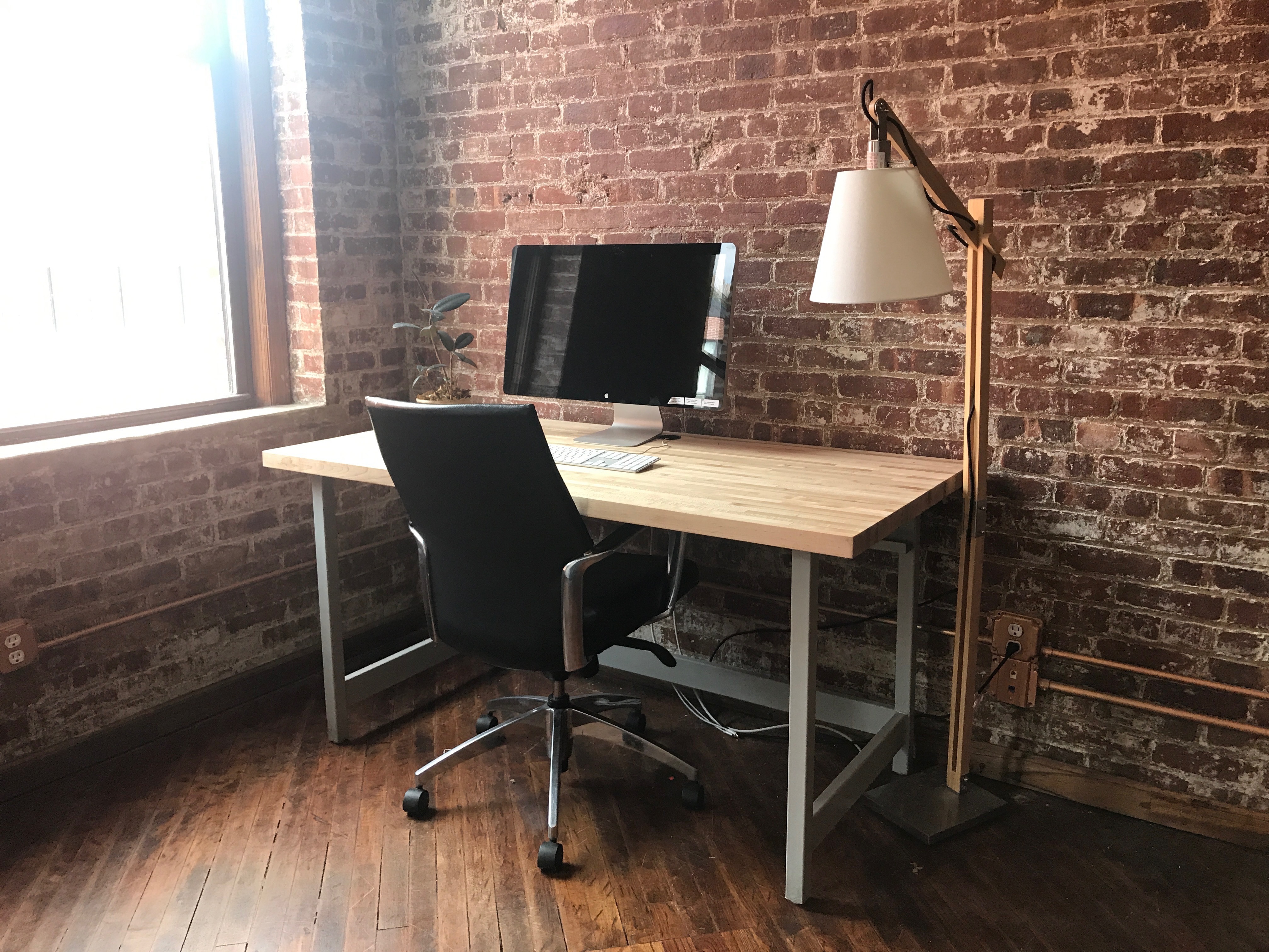 Sunny Desk with Exposed Brick & Original Wood Floors | Desks Near Me